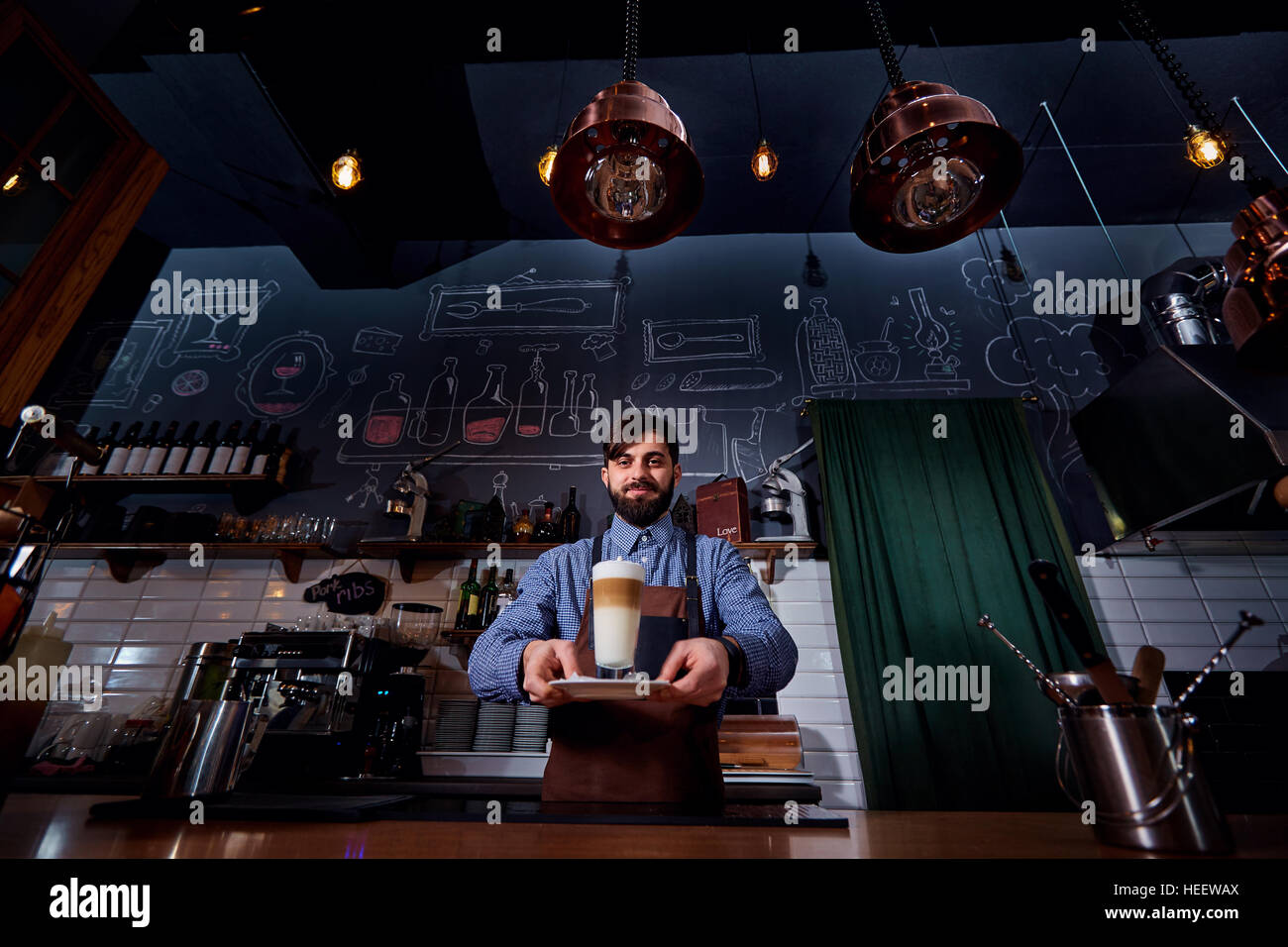 Barman barista in uniform making coffee tea, cocktails Stock Photo - Alamy
