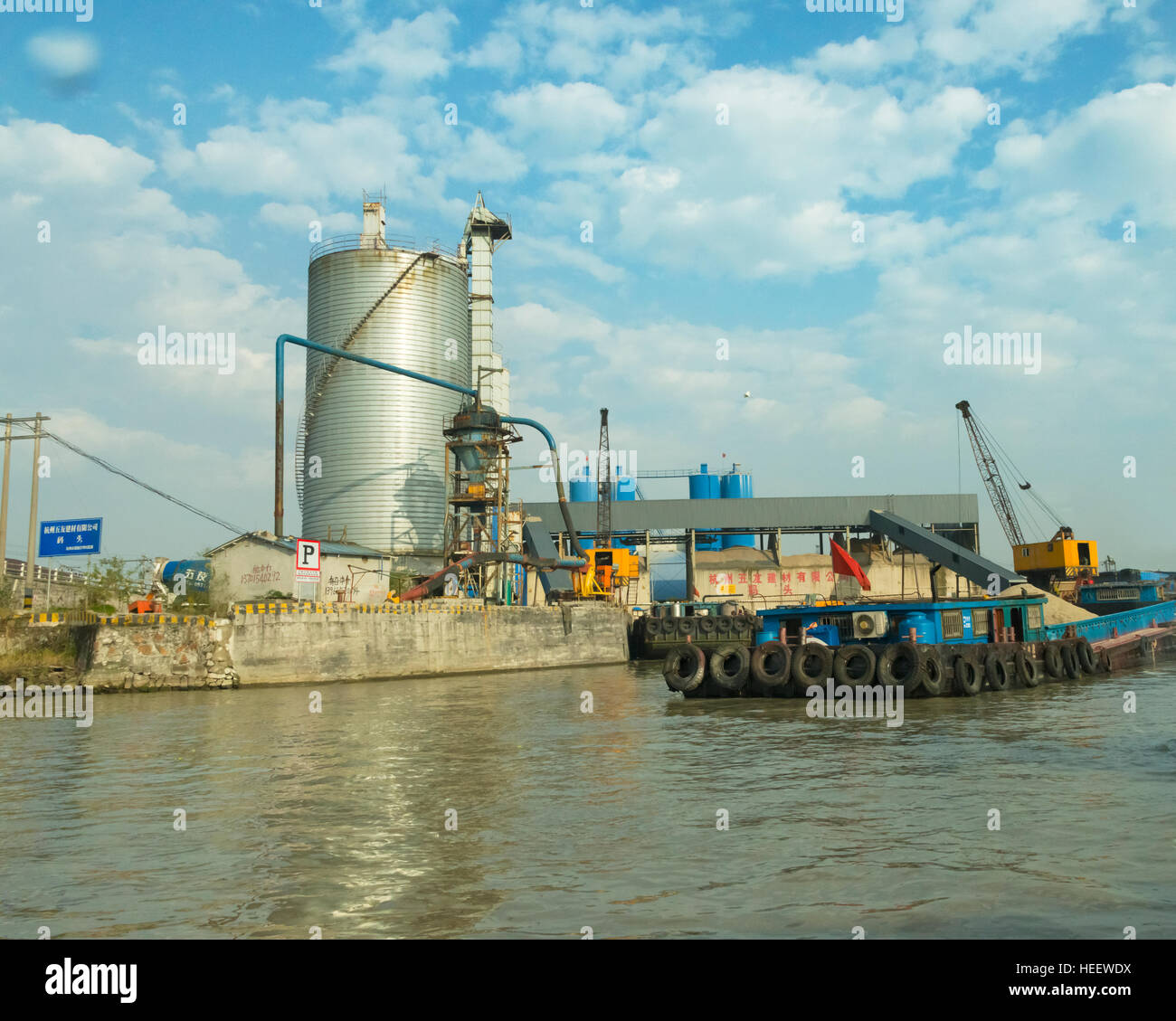 Barge at loading dock on the Grand Canal, Hangzhou, Zhejiang Province ...