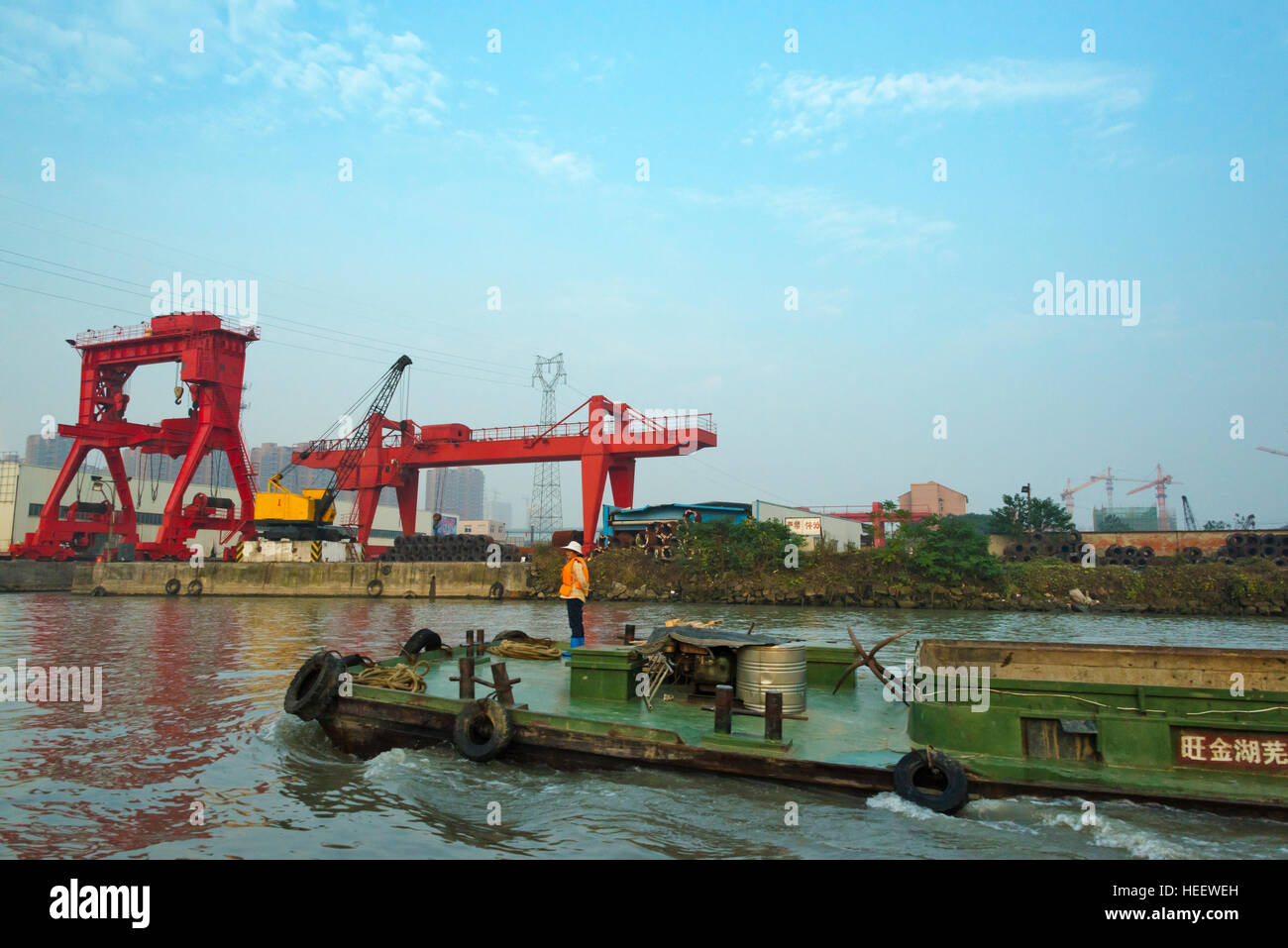 Barges at loading dock on the Grand Canal, Hangzhou, Zhejiang Province ...