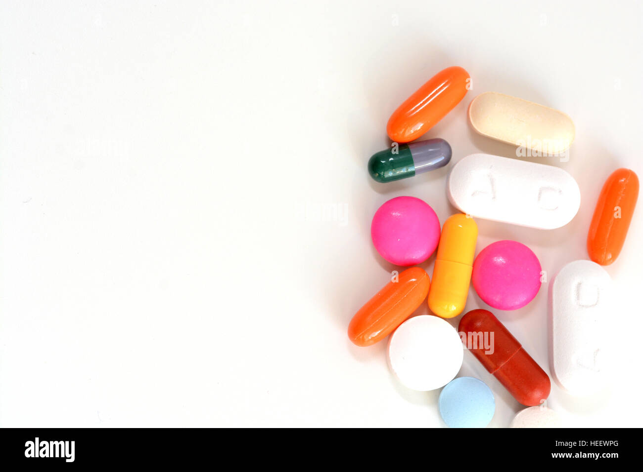Various colorful pills isolated on white background Stock Photo - Alamy