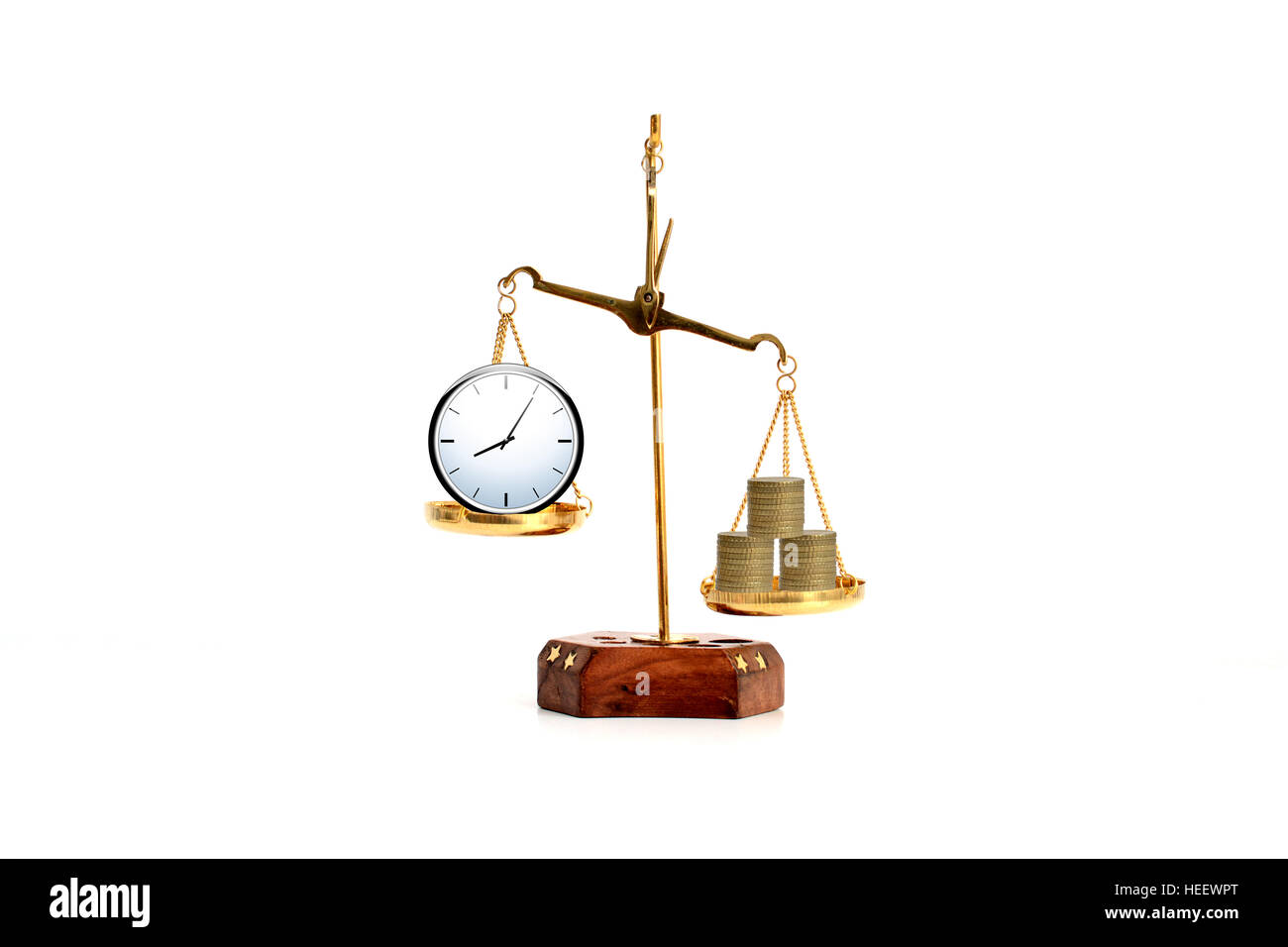 Time is money concept with time symbol and coins in a brass balance ...
