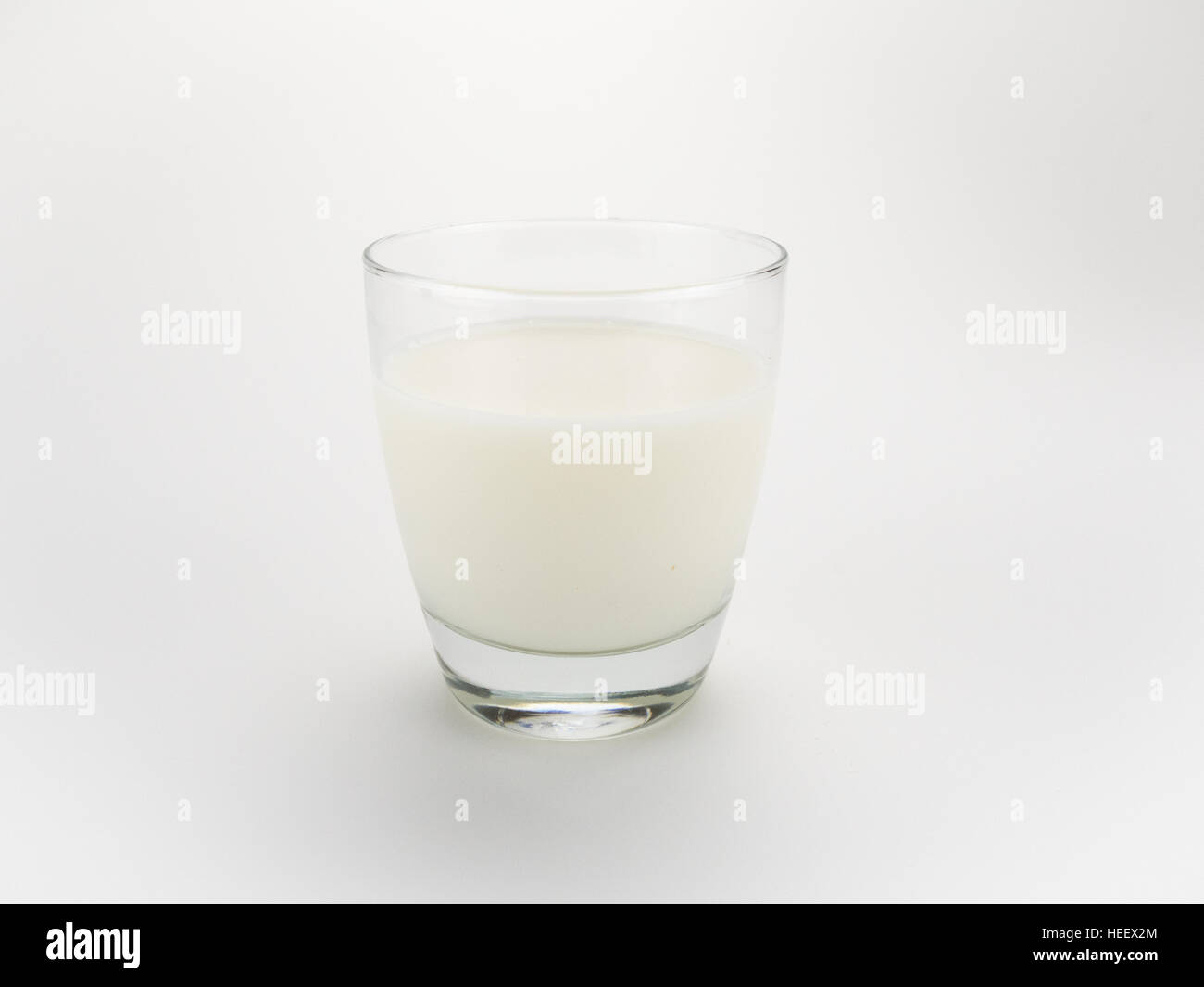 Milk in Glass Cup Isolated on White Background Stock Photo - Alamy