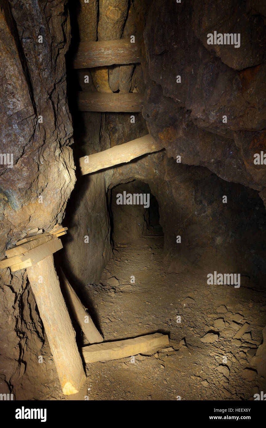 Inside an abandoned gold mine in the Nevada desert showing timbers and ...