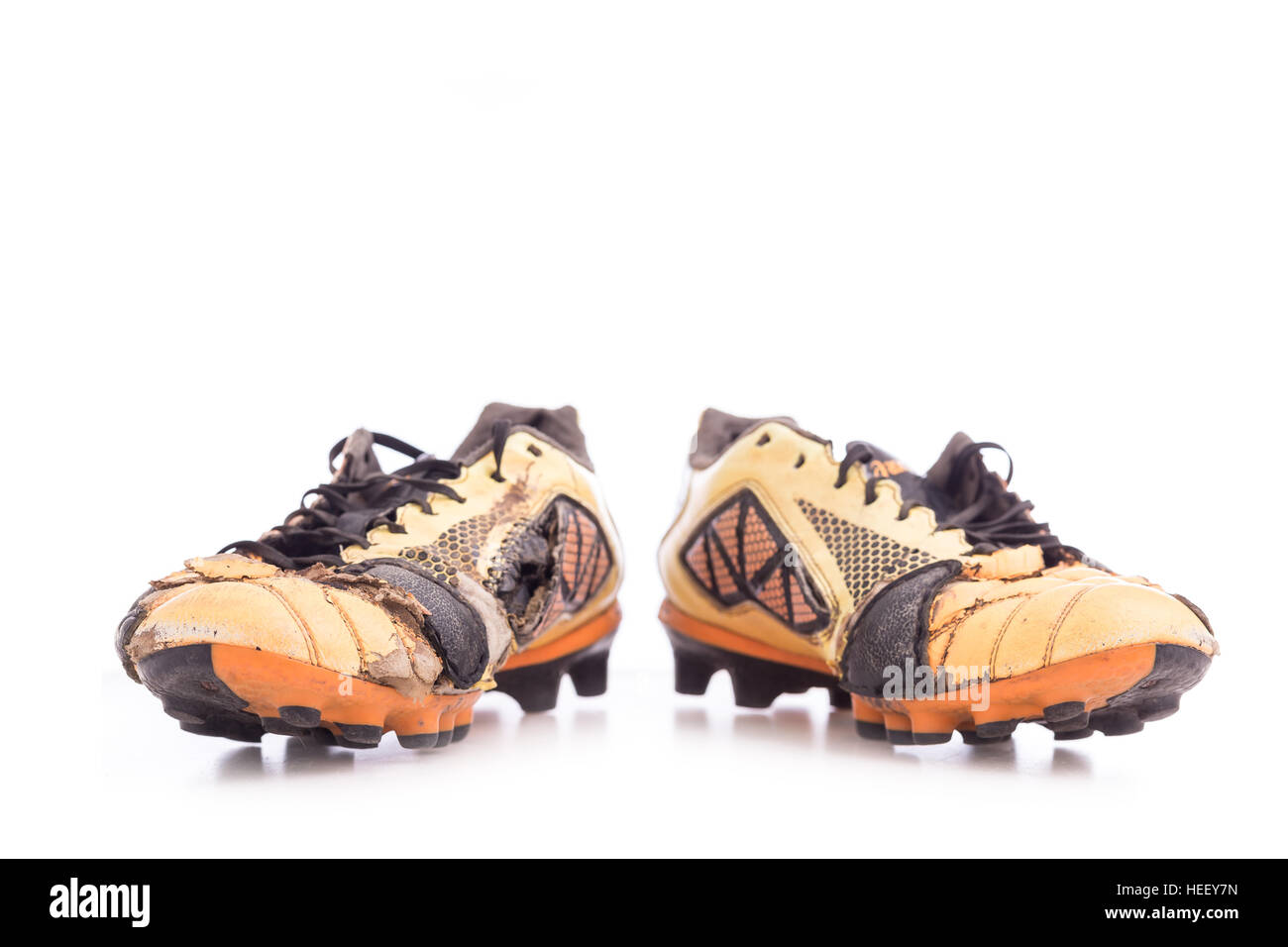 Old football shoes isolated on white background Stock Photo - Alamy