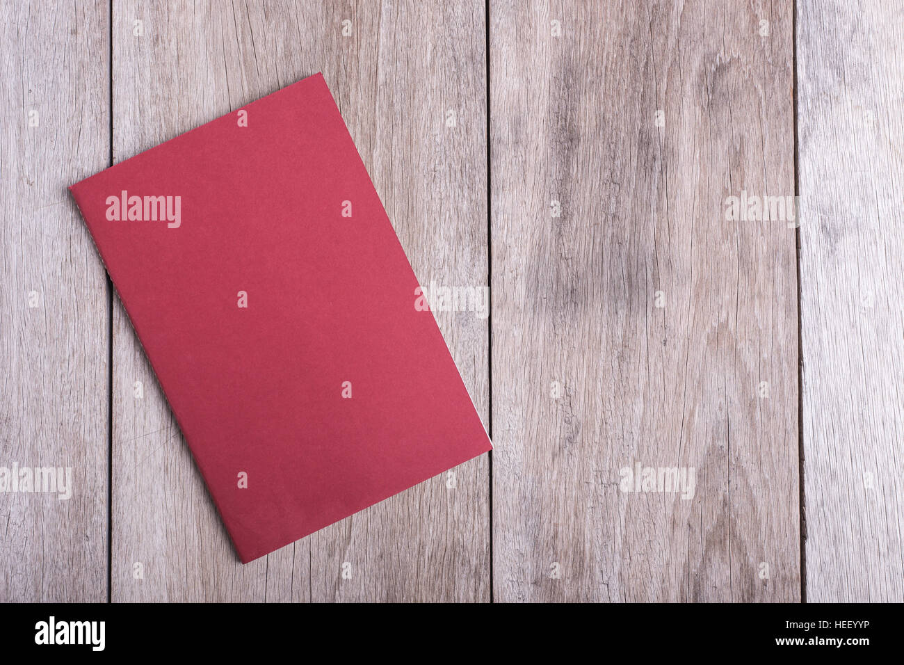 Top view of book on old wooden plank background Stock Photo - Alamy
