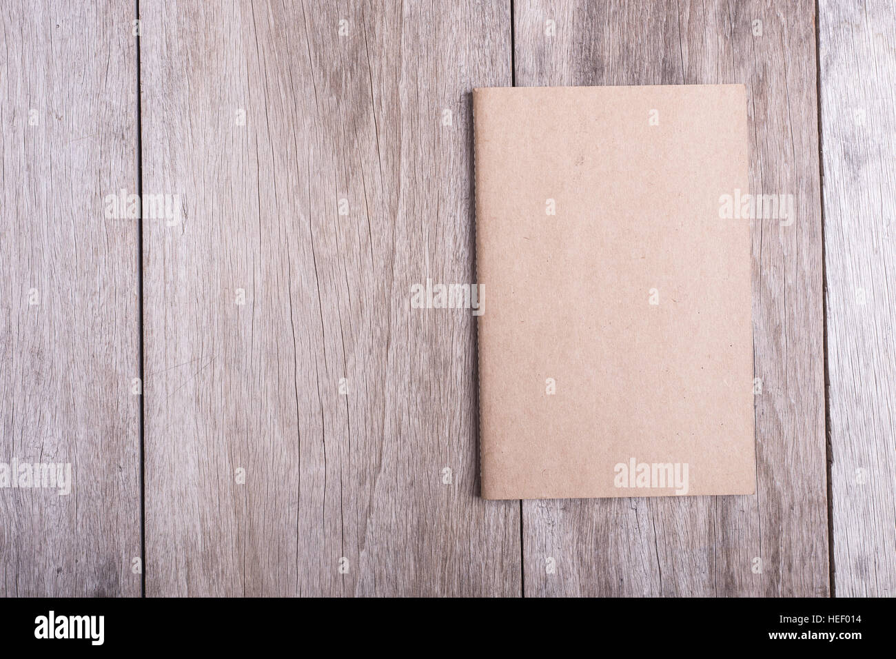 Top view of book on old wooden plank background Stock Photo - Alamy