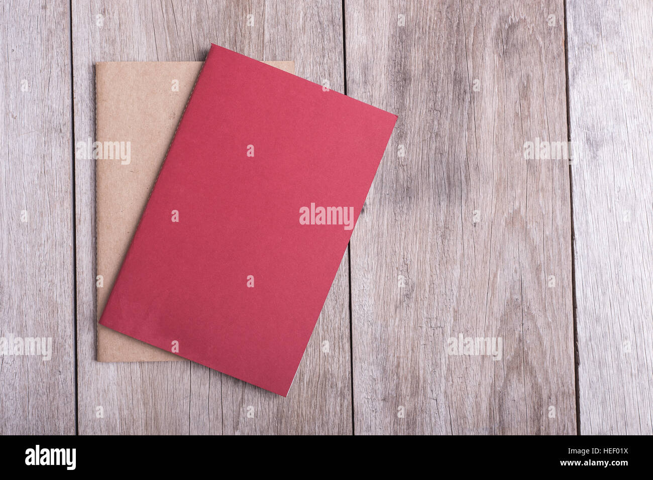 Top view of book on old wooden plank background Stock Photo - Alamy
