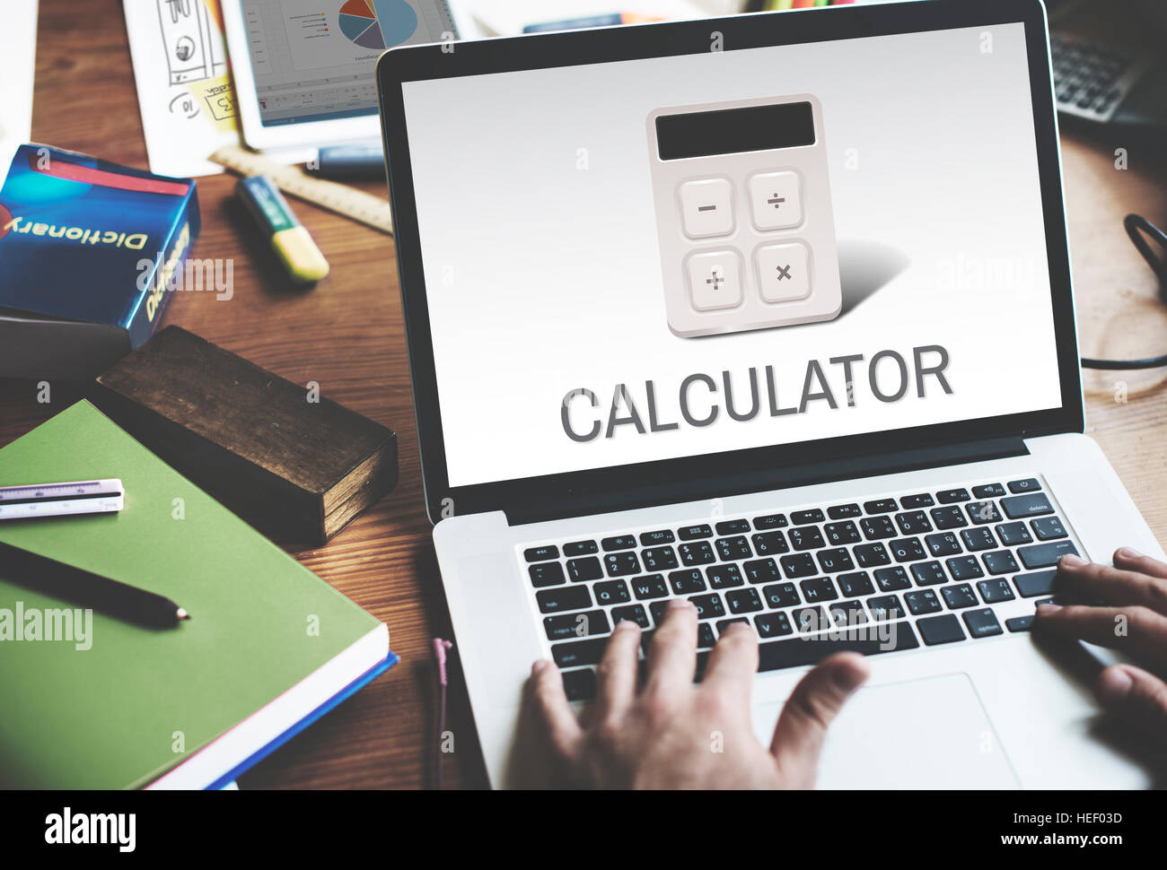 Finance concept book calculator hi-res stock photography and images - Alamy