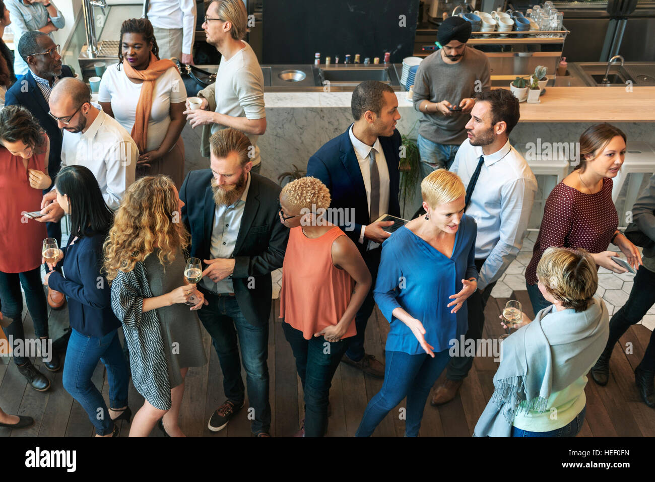 Group of people talking at party hi-res stock photography and images ...