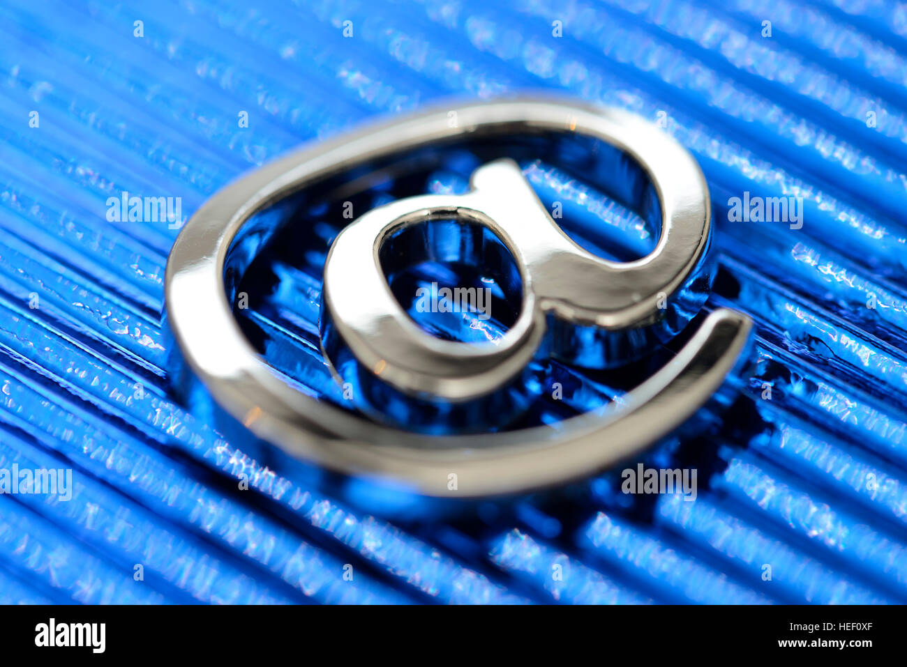 At sign on blue ground Stock Photo - Alamy