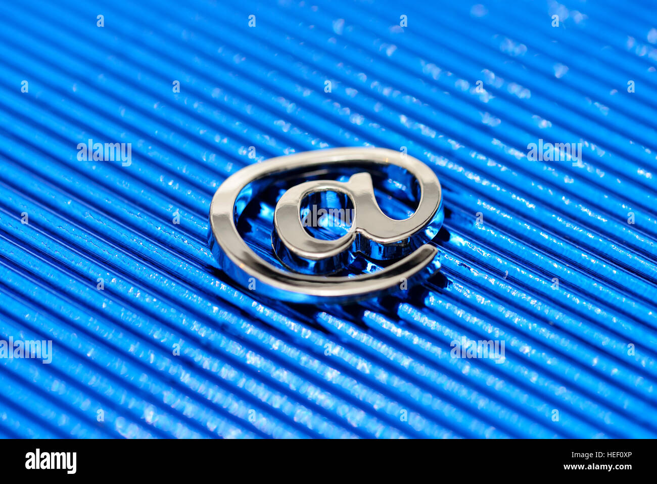 At sign on blue ground Stock Photo - Alamy