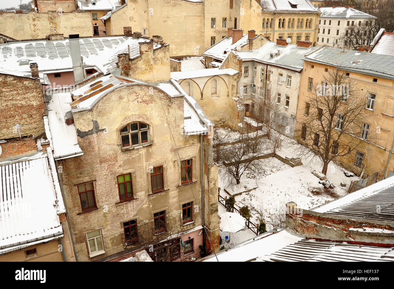 Old buildings and snow-covered roofs. Winter view of the downtown in ...