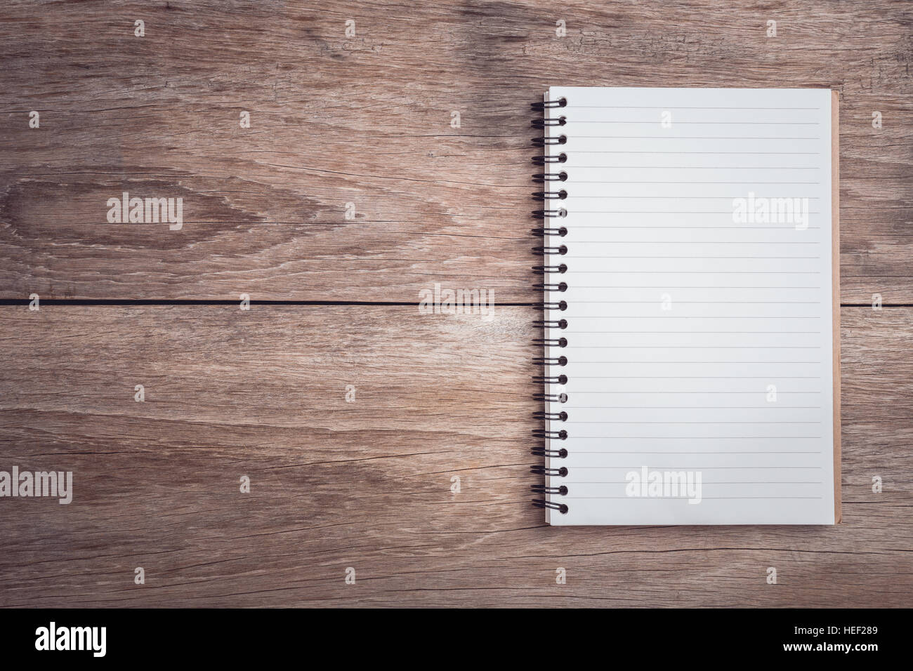 Close up notepad / lined paper on wooden table top view Stock Photo - Alamy