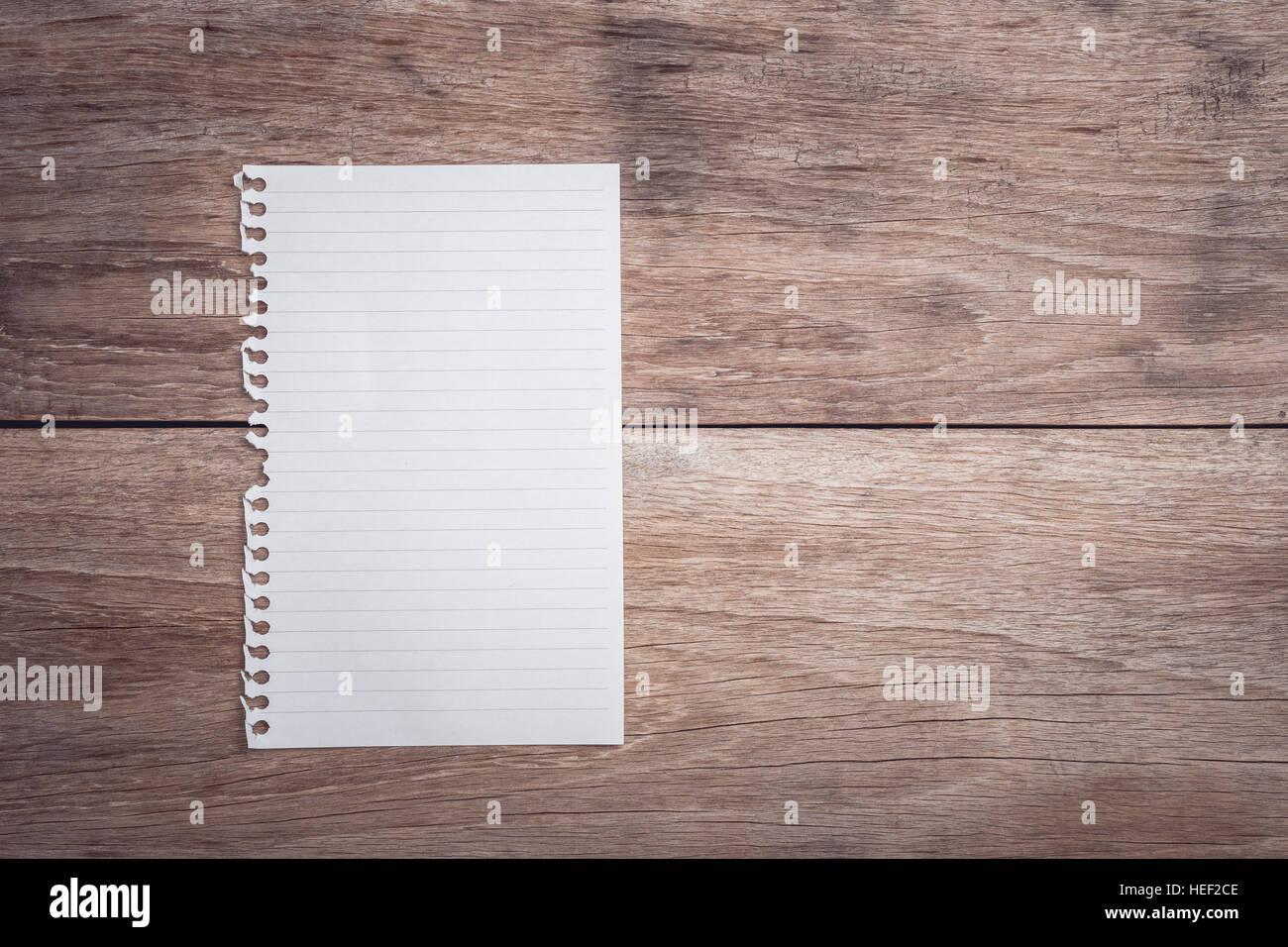 Close up notepad / lined paper on wooden table top view Stock Photo - Alamy