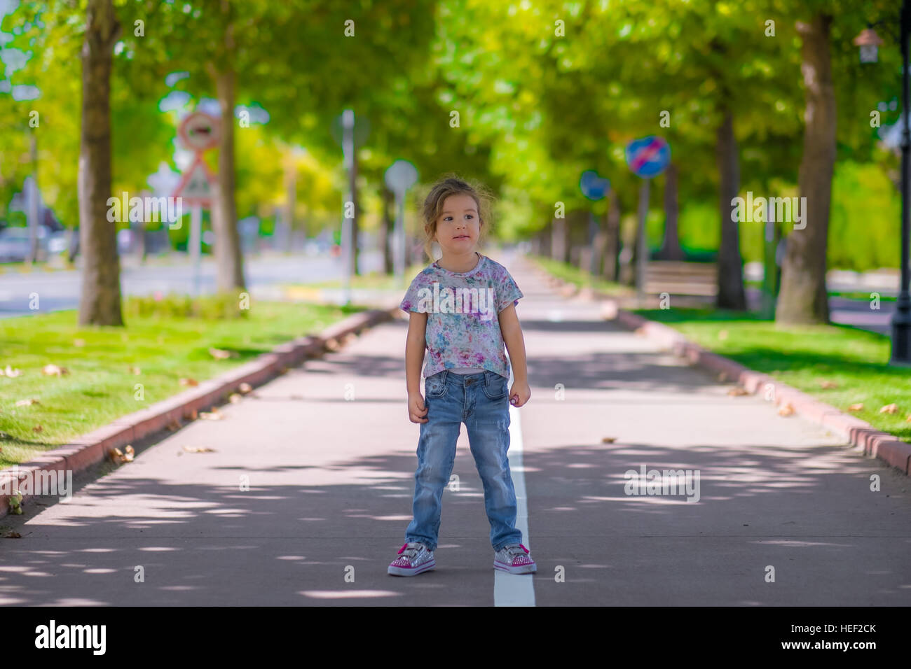 girl standing on the road Stock Photo - Alamy
