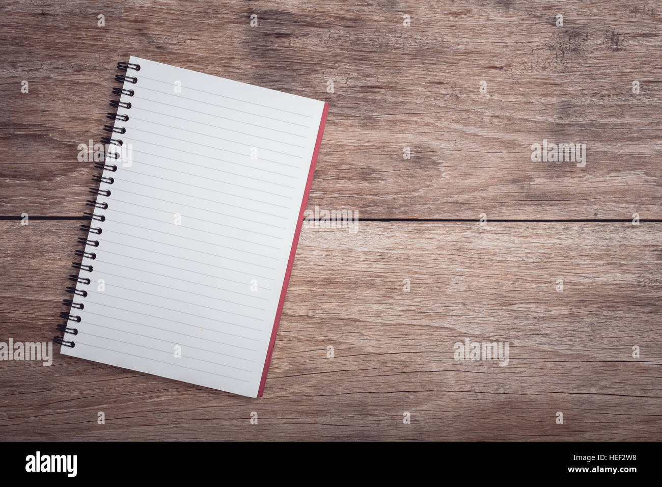Close up notepad / lined paper on wooden table top view Stock Photo - Alamy