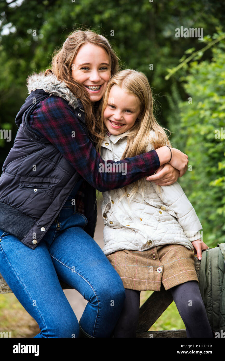 Sister Hug Togetherness Outdoors Girls Concept Stock Photo - Alamy