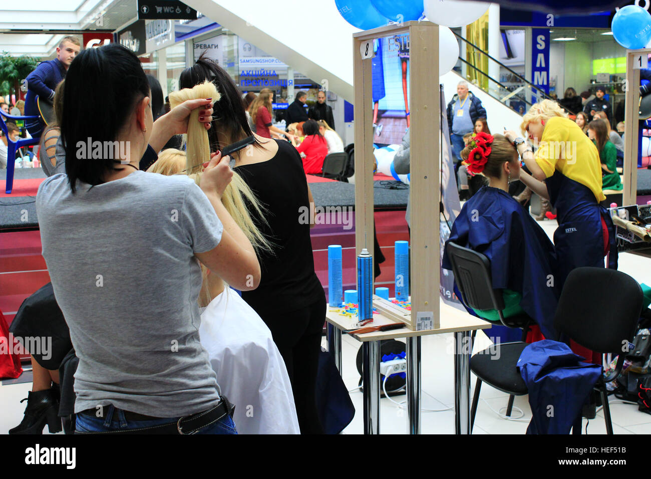 hairdressers make modern hairstyle on the barbers contest featuring ...