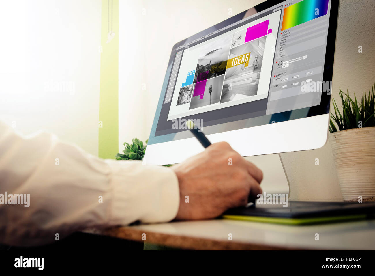 designer designing a layout. All screen graphics are made up Stock ...