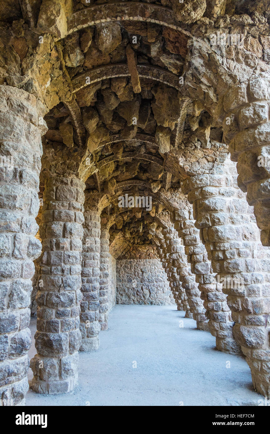 A line of stone arches in Park Grüell designed by Gaudi (Gaudí) in ...