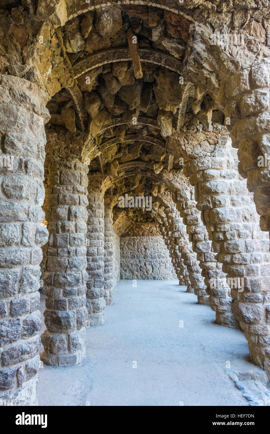 A line of stone arches in Park Grüell designed by Gaudi (Gaudí) in ...