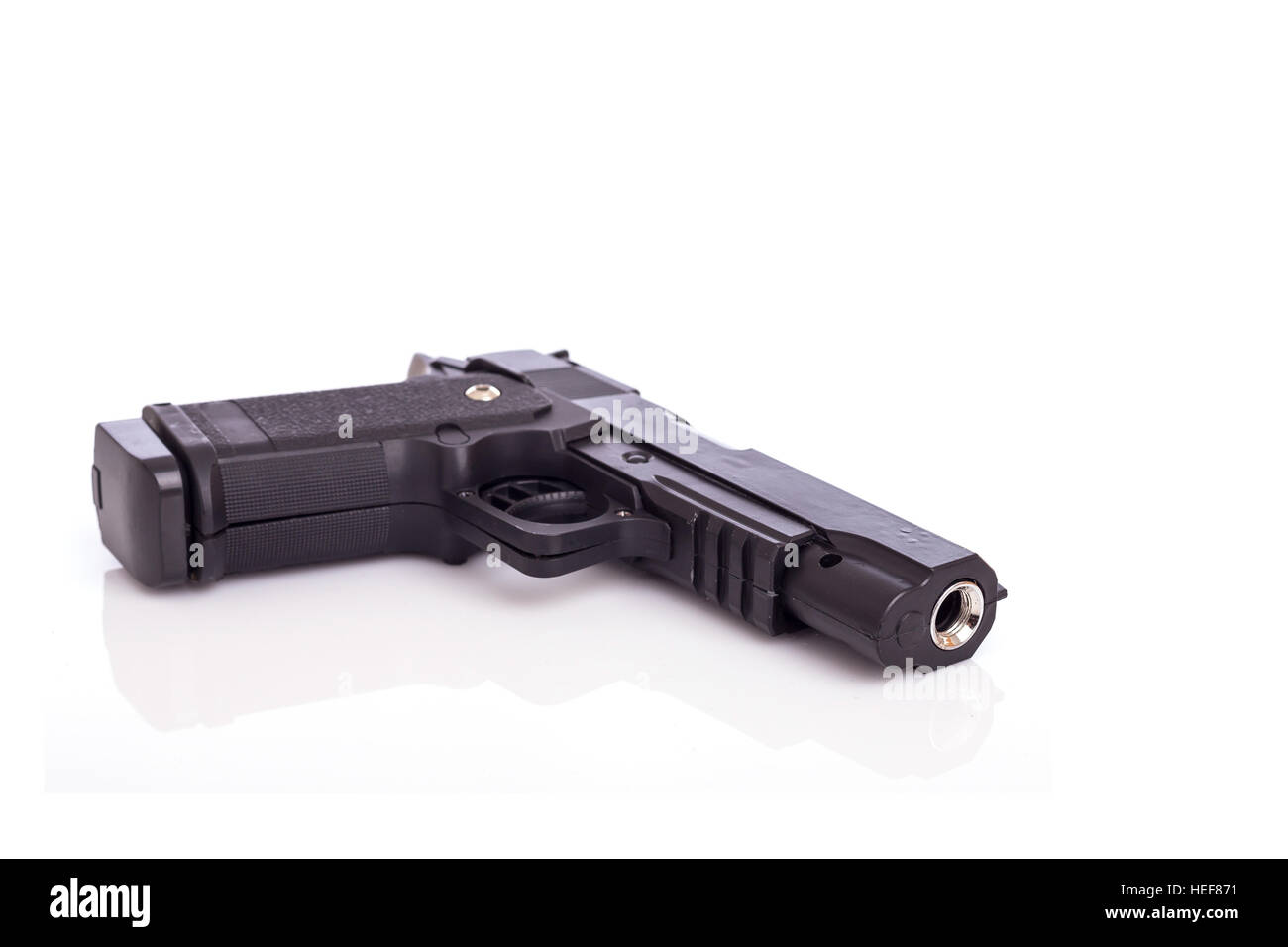 Close up black gun isolated on white background Stock Photo - Alamy