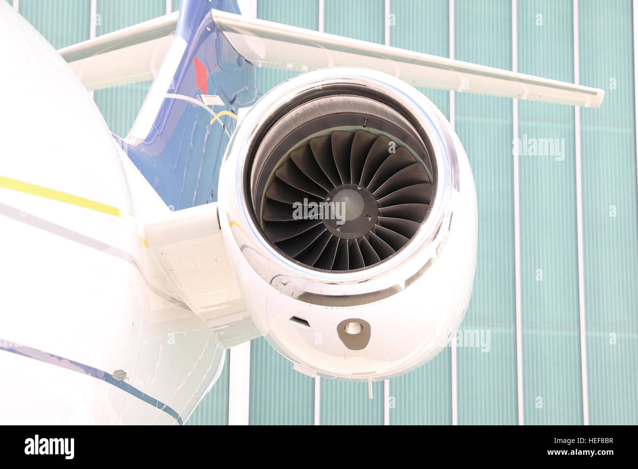 Engine of a white business jet on ground Stock Photo - Alamy