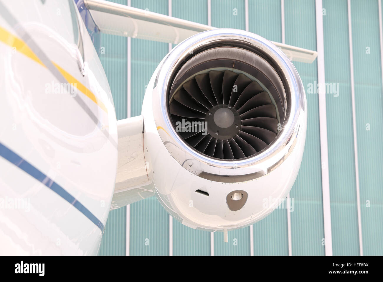Engine of a white business jet on ground Stock Photo - Alamy
