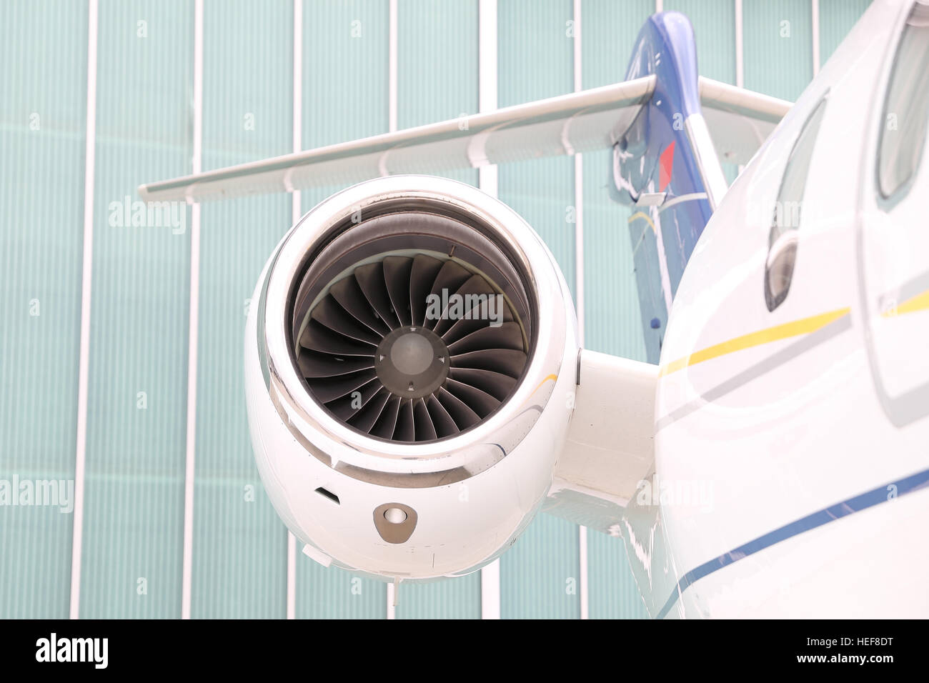Engine of a white business jet on ground Stock Photo - Alamy