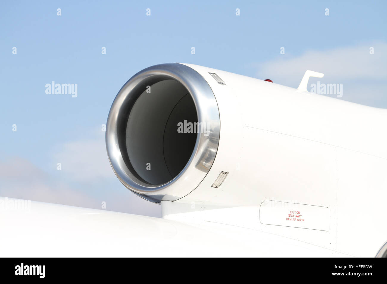 Engine of a white business jet on ground Stock Photo - Alamy