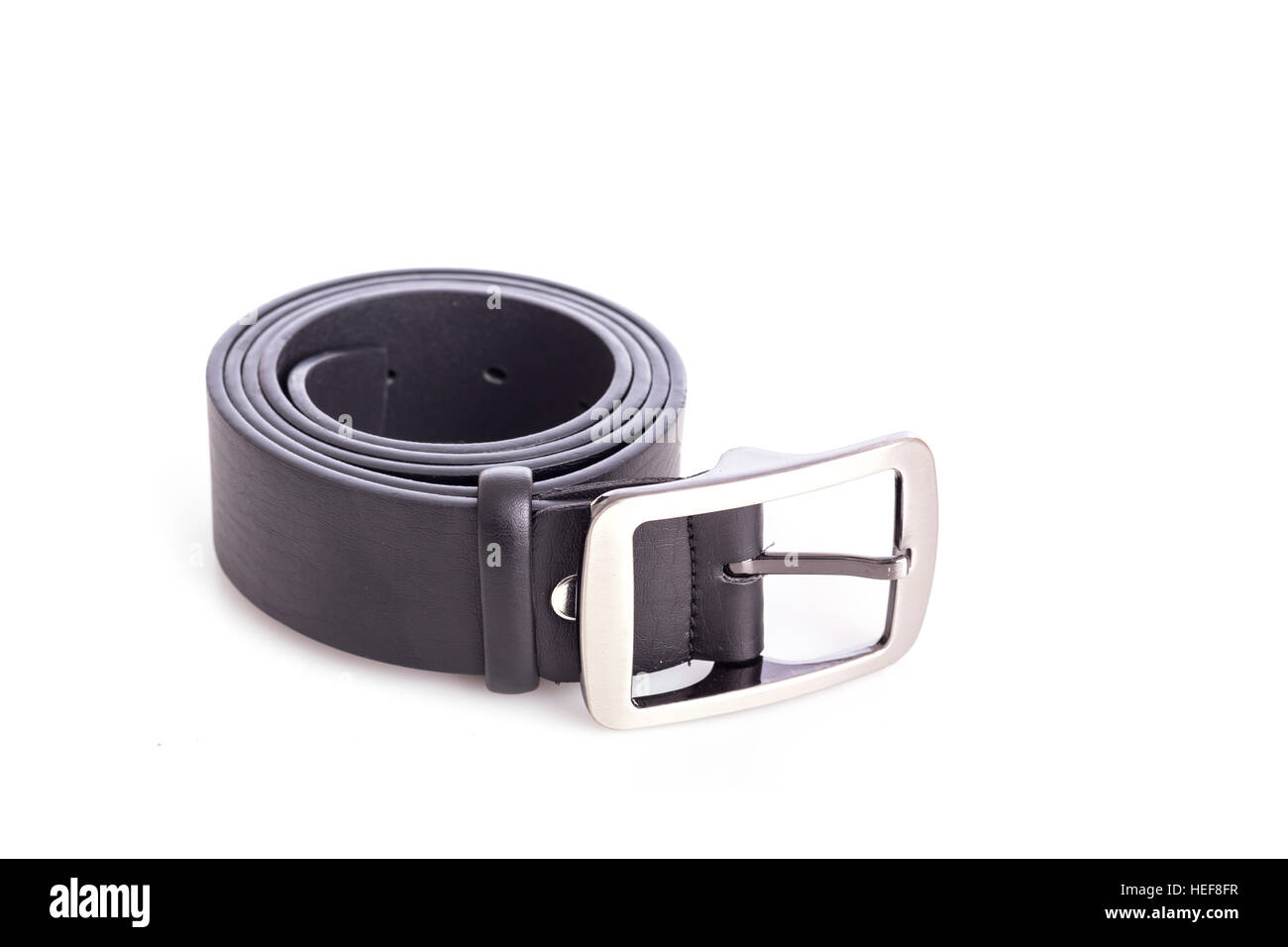 Close up new black belt isolated on white background Stock Photo - Alamy