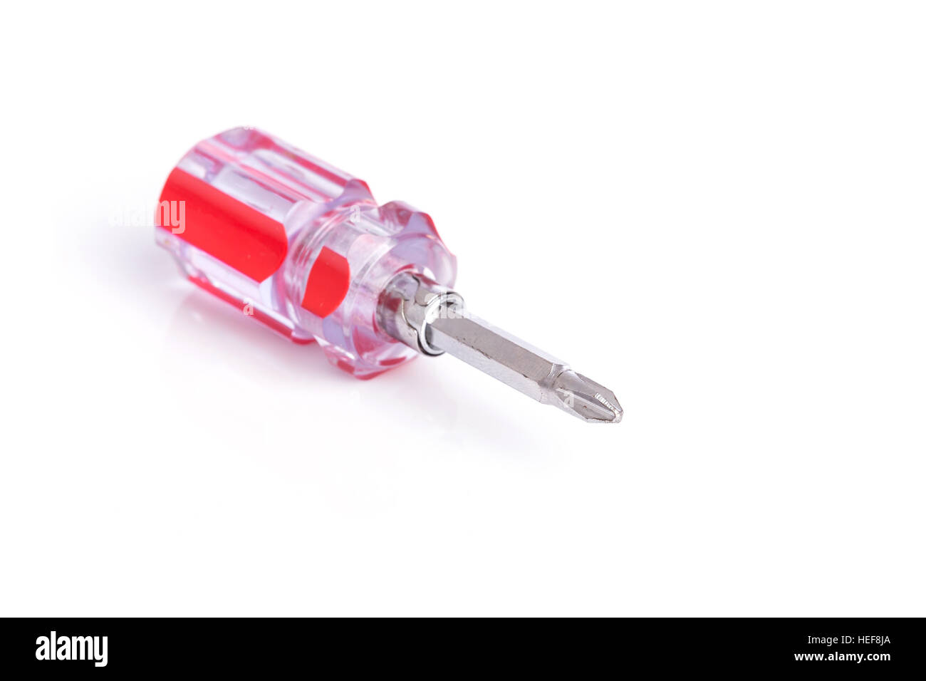 Close up short screwdriver isolated on white background Stock Photo - Alamy