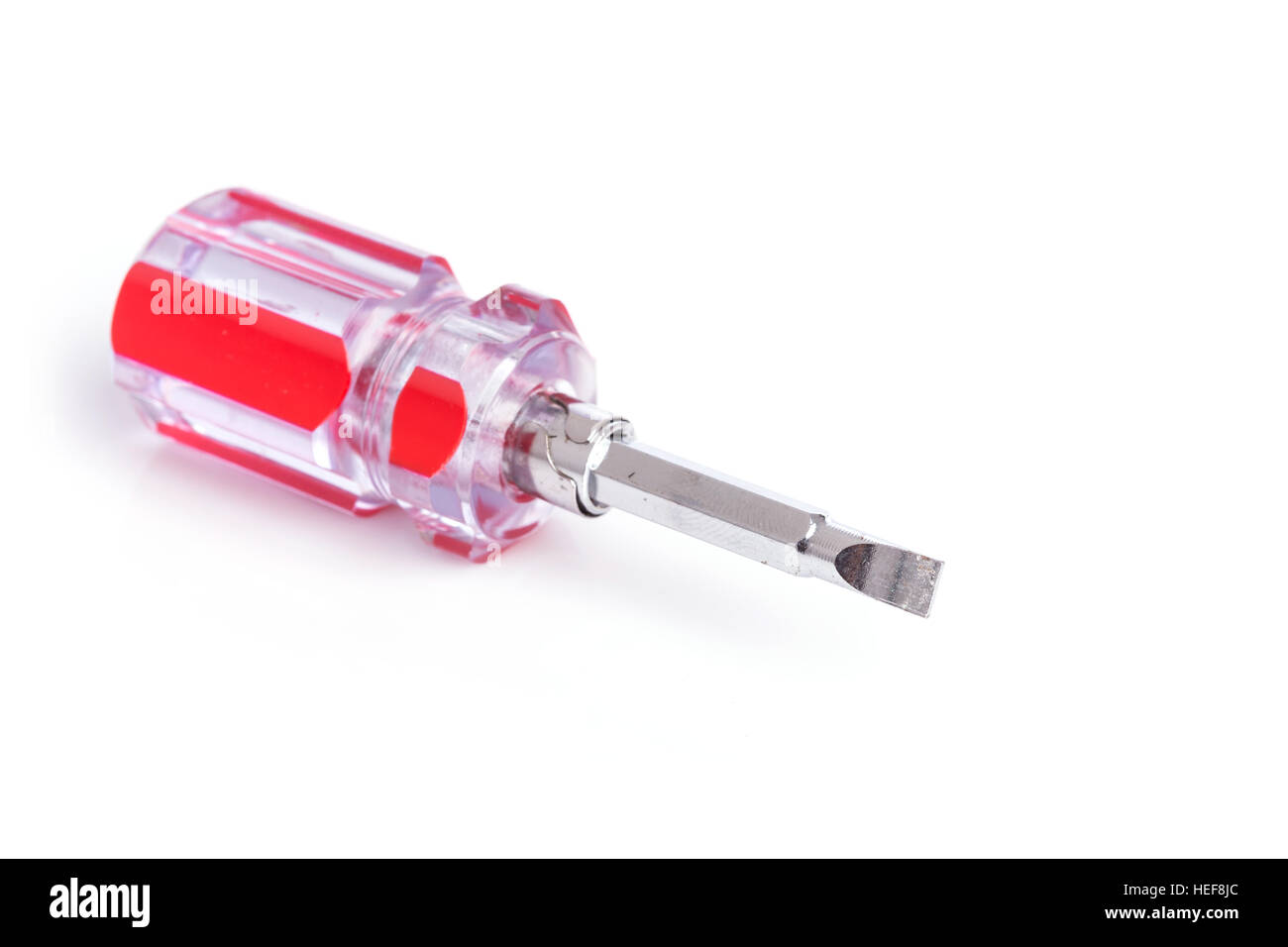 Close up short screwdriver isolated on white background Stock Photo - Alamy