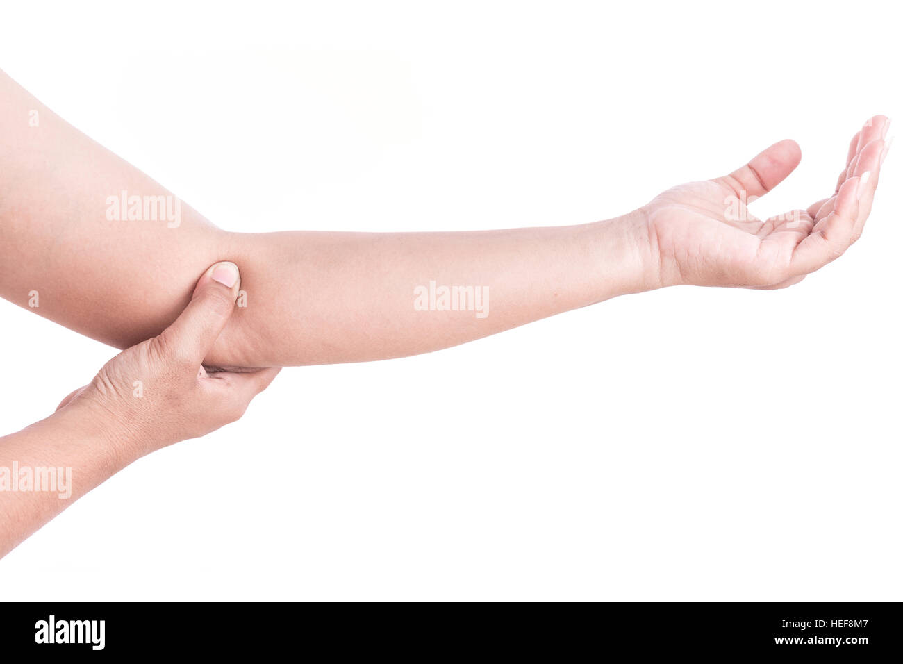 Close up woman's hand holding her elbow isolated on white background ...