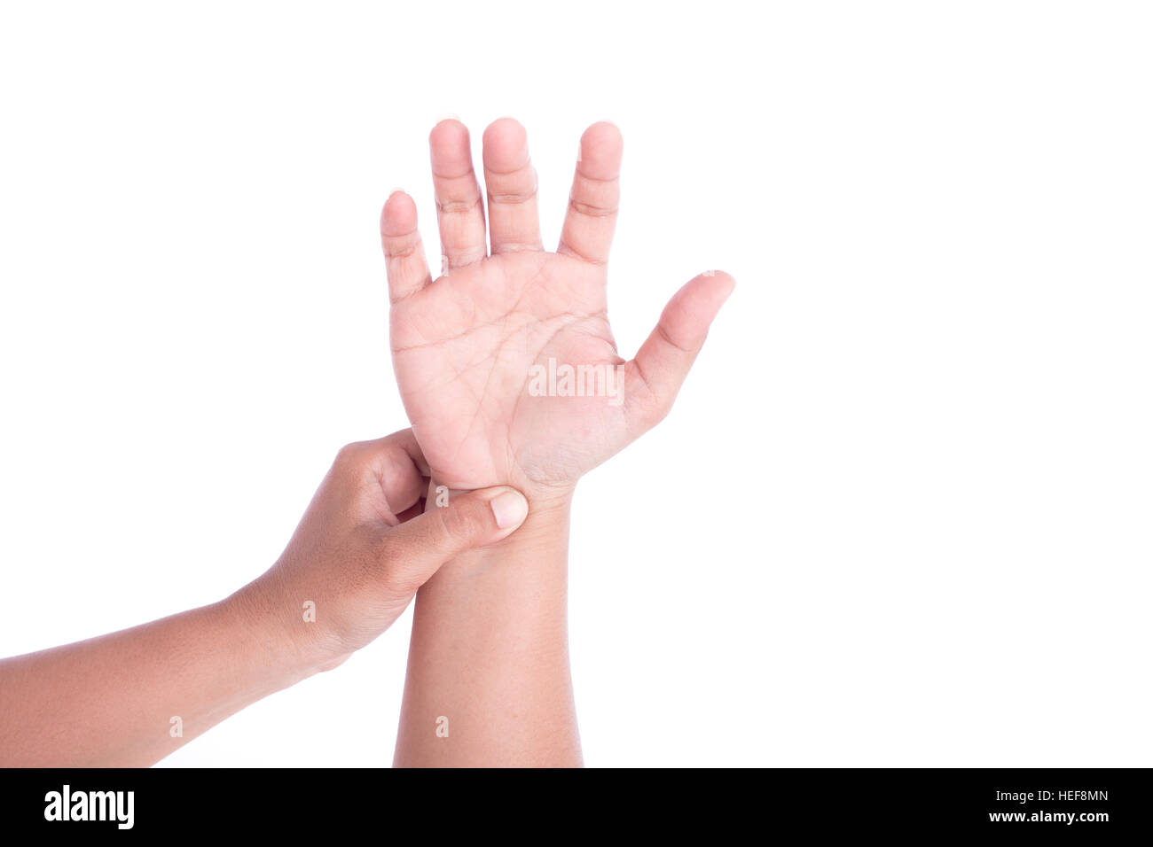 Close up woman's hand holding her wrist isolated on white background ...