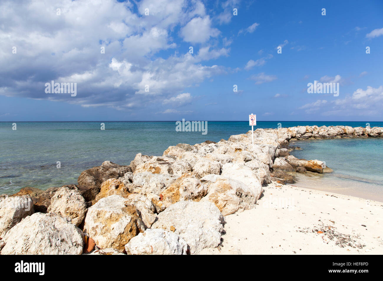 The line of stone to make a natural sea pool on Grand Cayman island ...