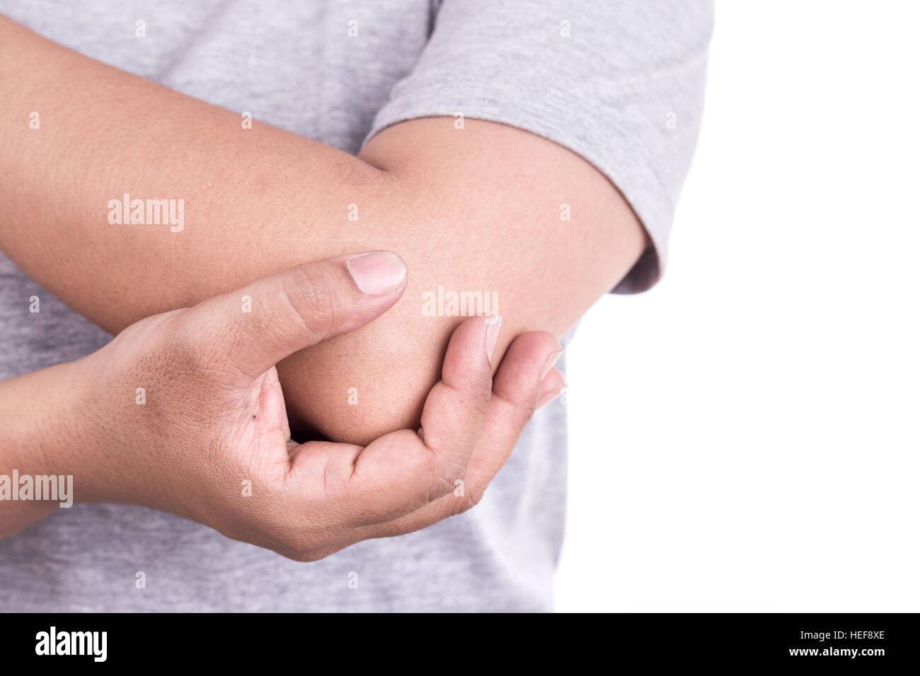 Close up woman's hand holding her elbow isolated on white background ...