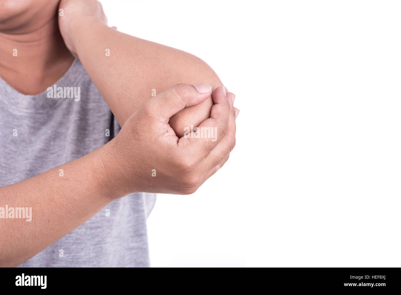 Close up woman's hand holding her elbow isolated on white background ...
