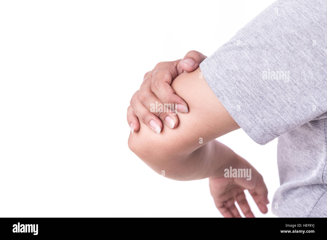 Close up woman's hand holding her elbow isolated on white background ...