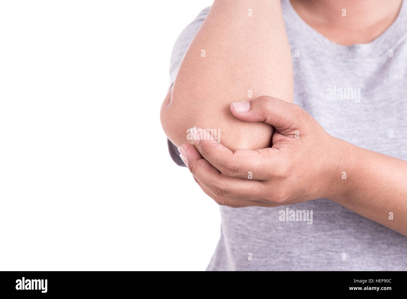 Close up woman's hand holding her elbow isolated on white background ...