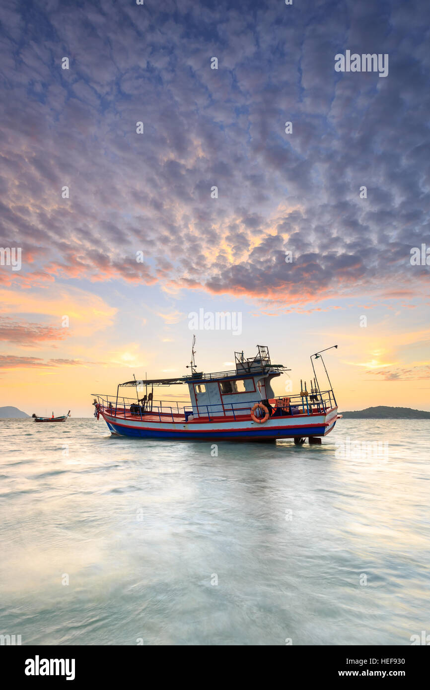 Fishing boat stand at sunrise beach in Phuket, Thailand Stock Photo - Alamy