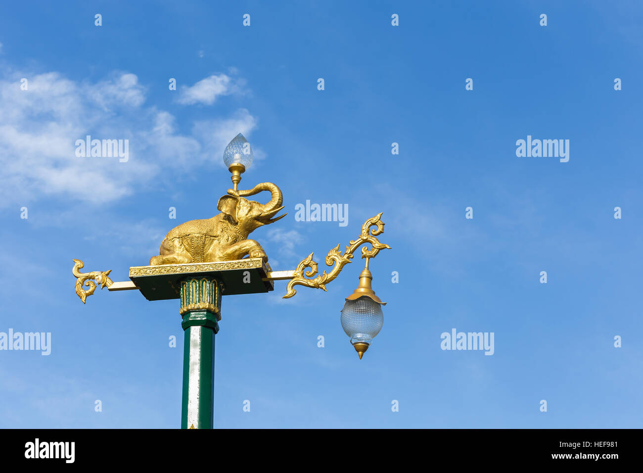 Traditional Thai style light pole with elephant statue on blue sky ...