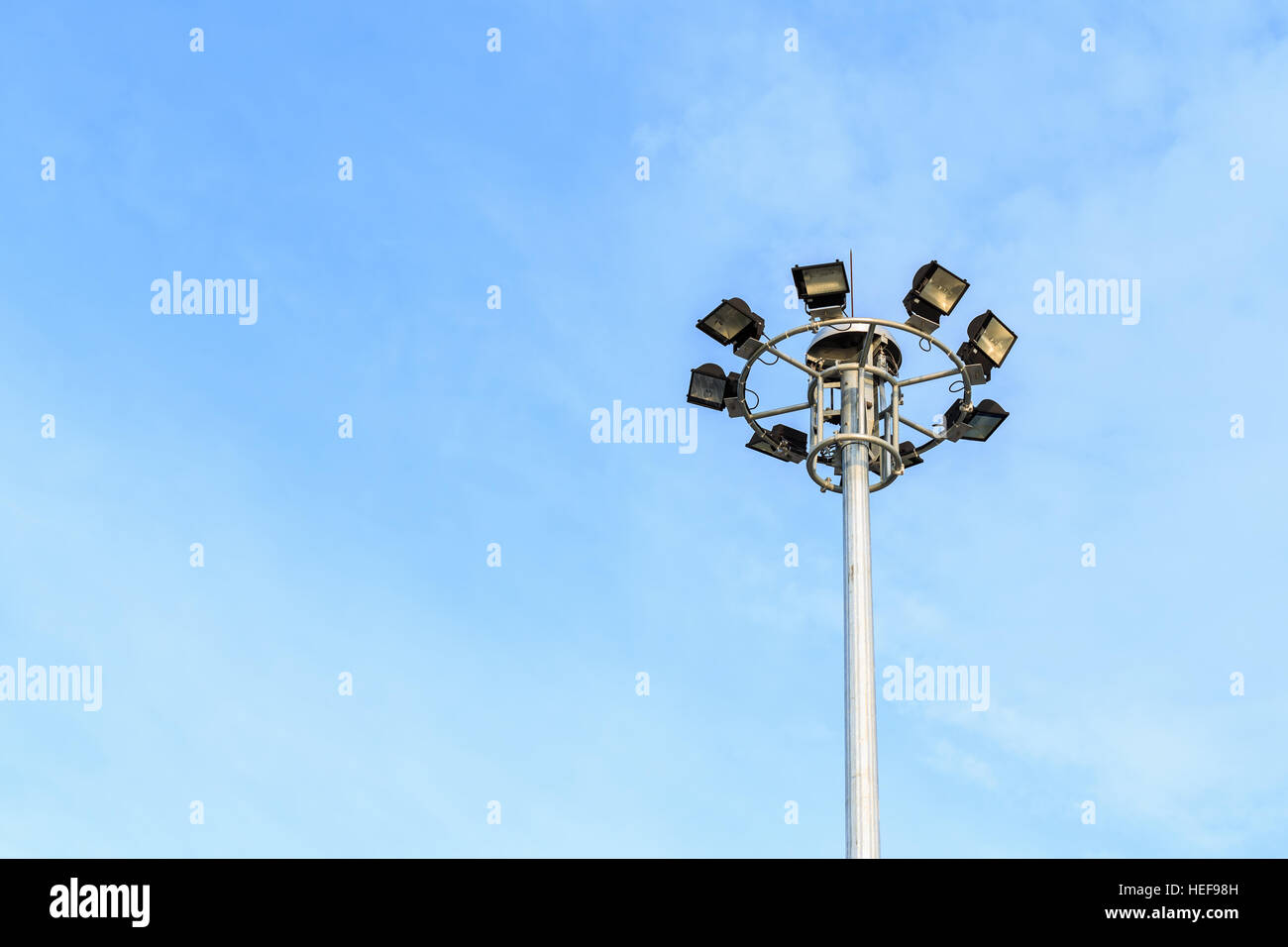 Spot-light tower at the road on blue sky background Stock Photo - Alamy