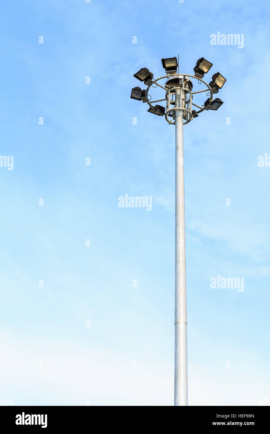 Spot-light tower at the road on blue sky background Stock Photo - Alamy
