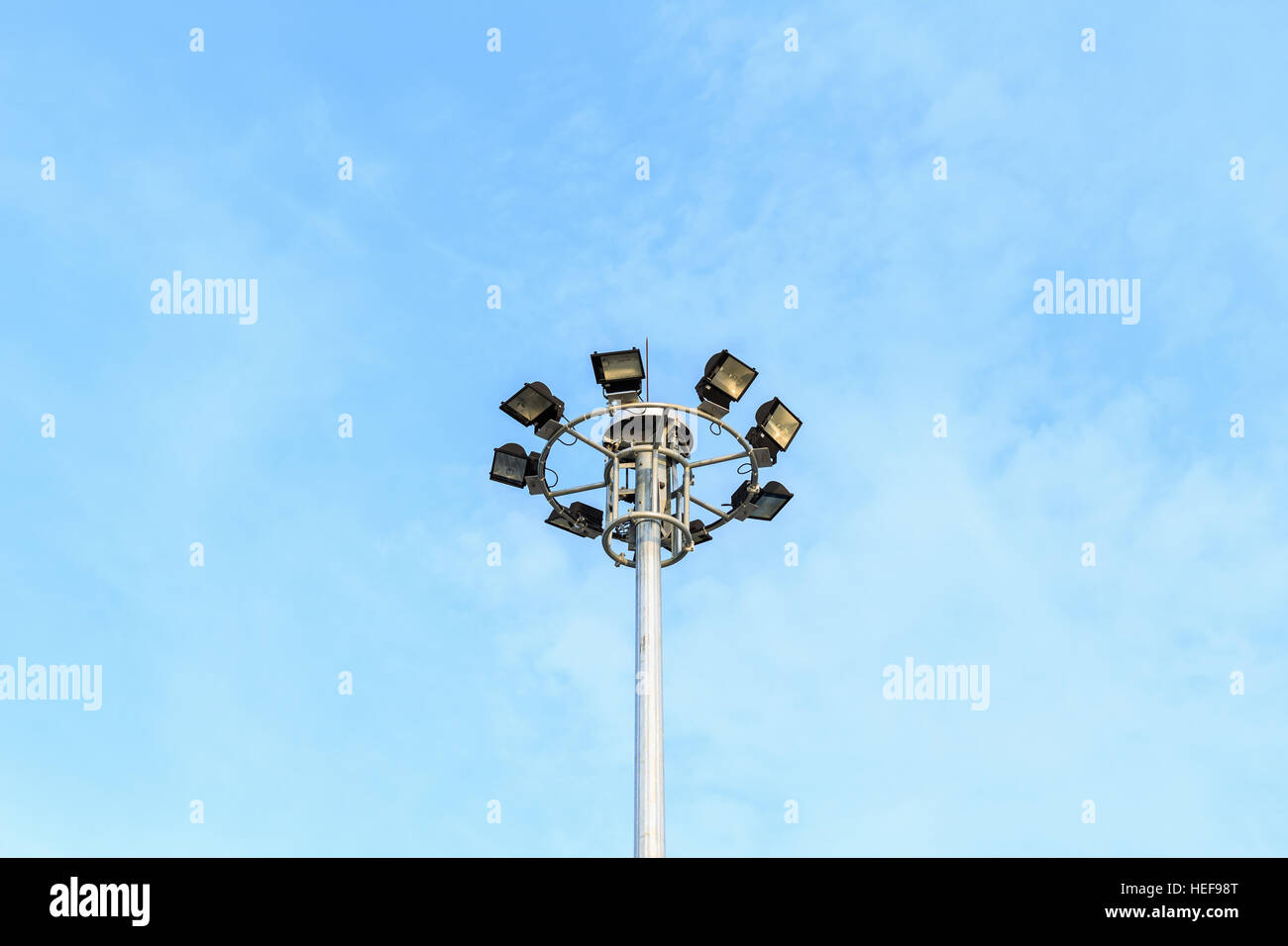 Spot-light tower at the road on blue sky background Stock Photo - Alamy