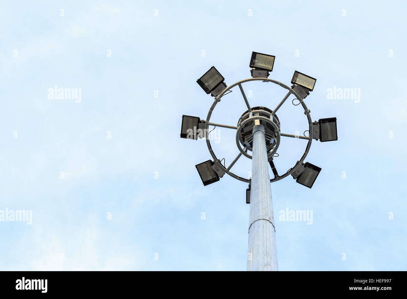 Spot-light tower at the road on blue sky background Stock Photo - Alamy