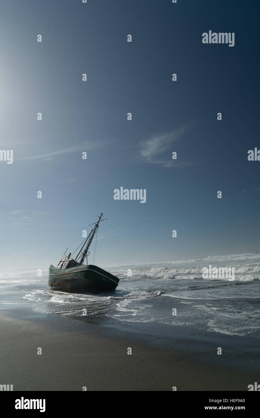 Wrecked ship on beach Stock Photo - Alamy