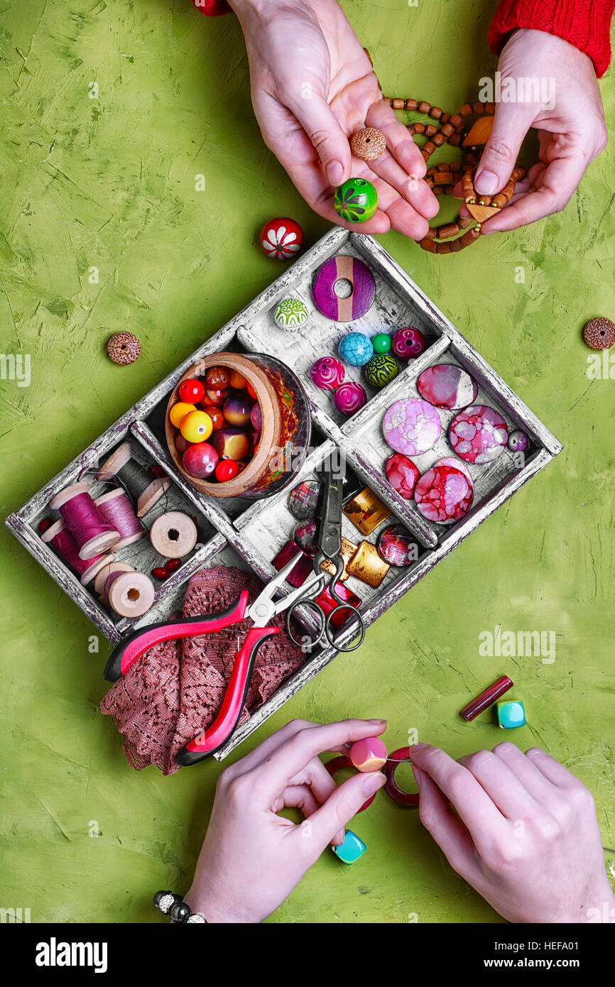 Women hands collecting the bracelets and beads Stock Photo - Alamy