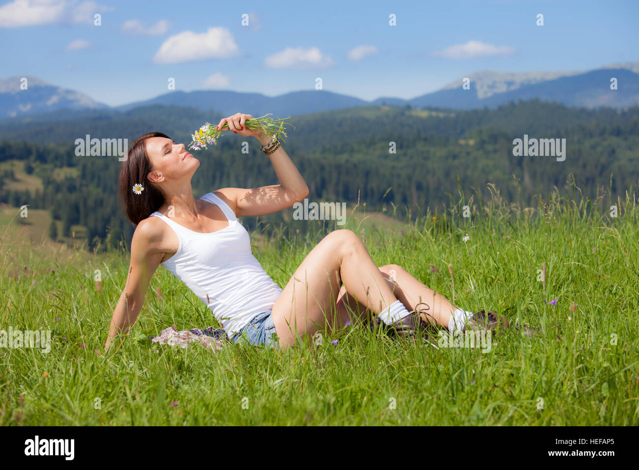 Teen girl lying in field hi-res stock photography and images - Alamy