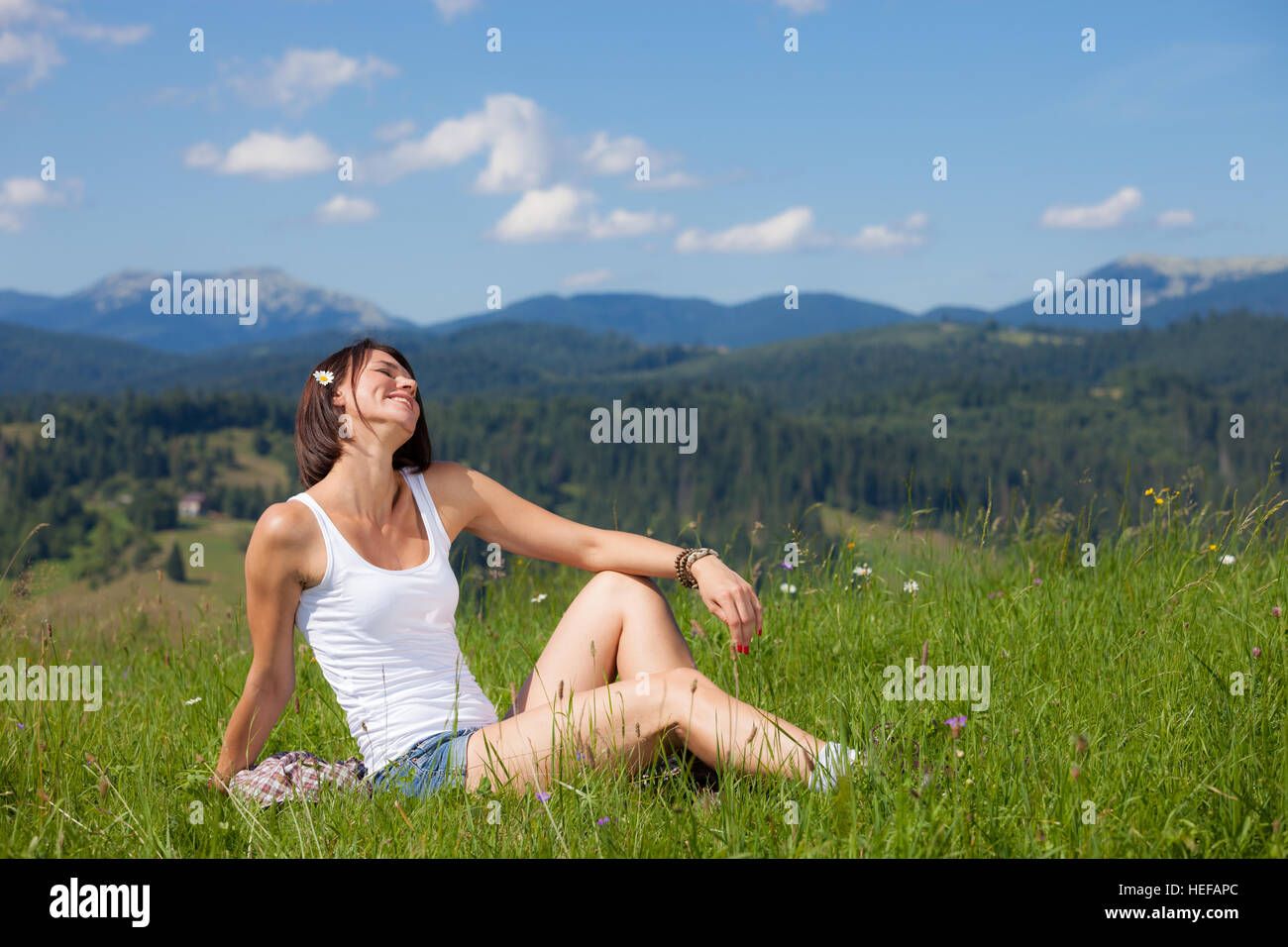 Teen girl lying on field hi-res stock photography and images - Alamy